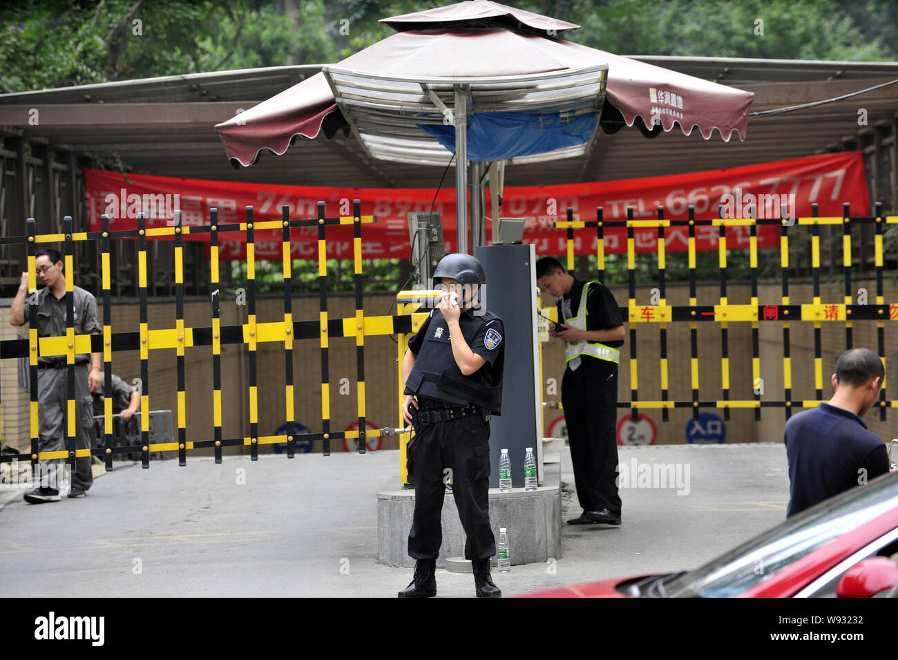 Local police officers are seen outside a housing estate after gunshots ...