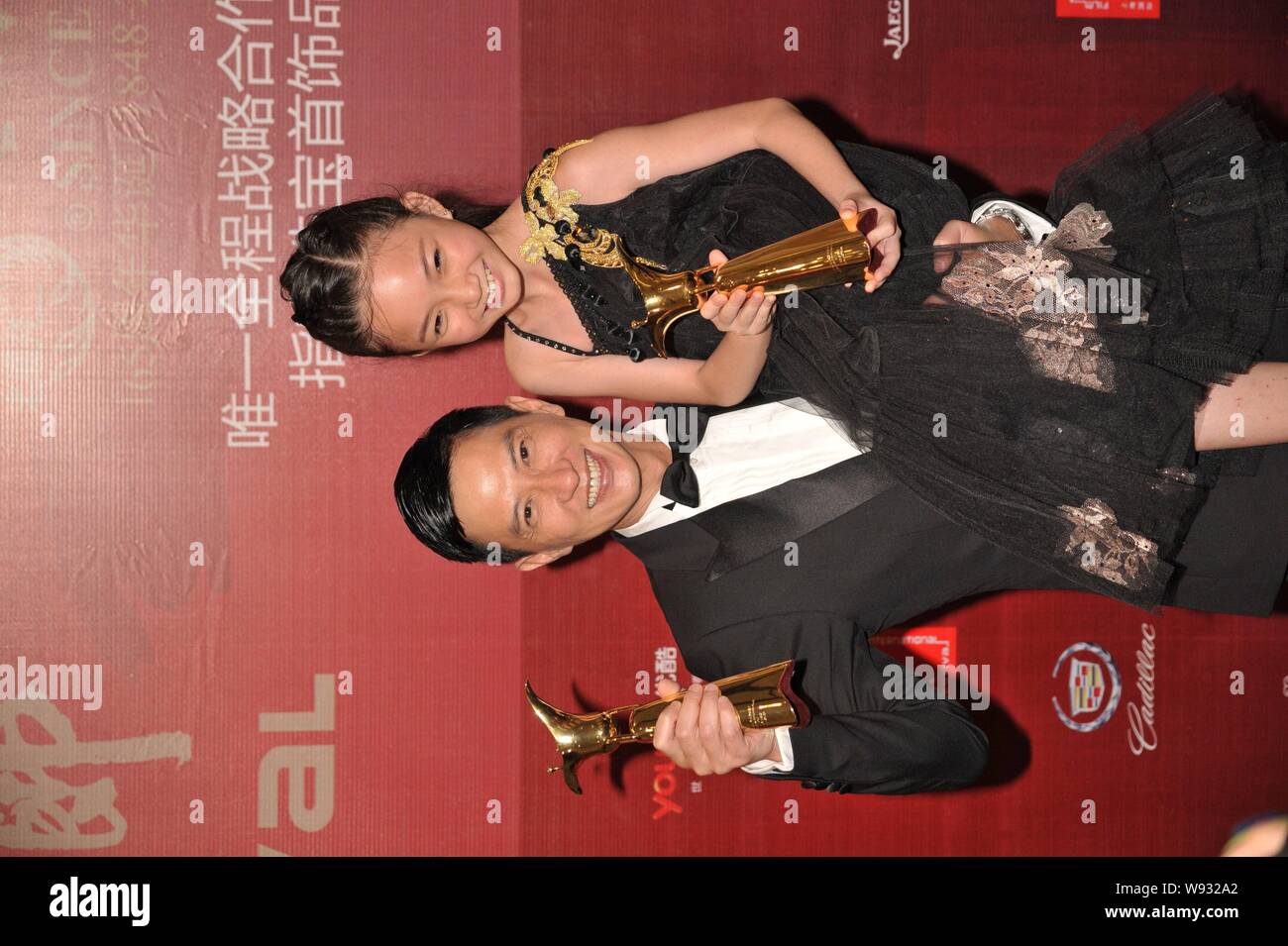 Hong Kong actor Nick Cheung Ka-fai, left, hold 10-year-old Malaysian ...