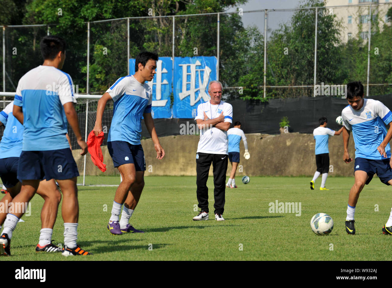 Swedish soccer coach Sven-Goran Eriksson, center, instructs local ...