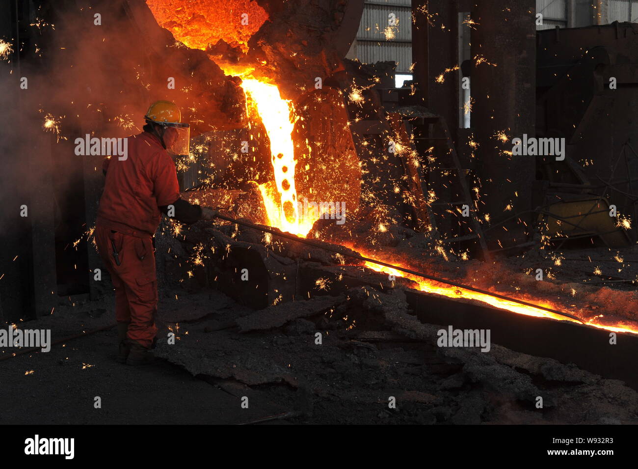 --FILE--A Chinese worker is seen at a steel plant in Dalian, northeast ...
