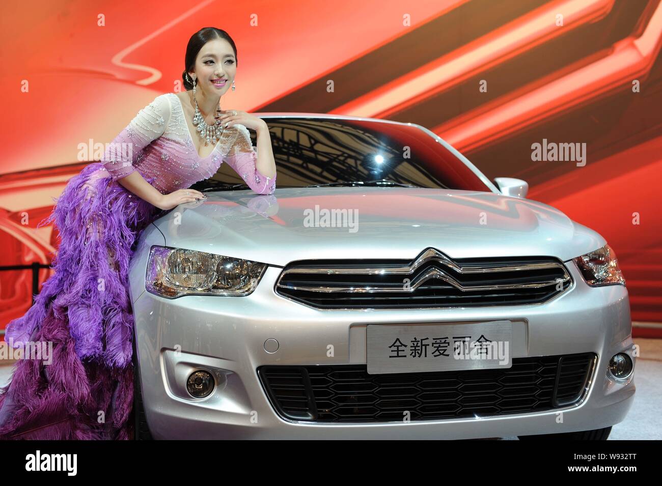 Chinese model Cao Yang poses with a Citroen Elysee during the 15th ...