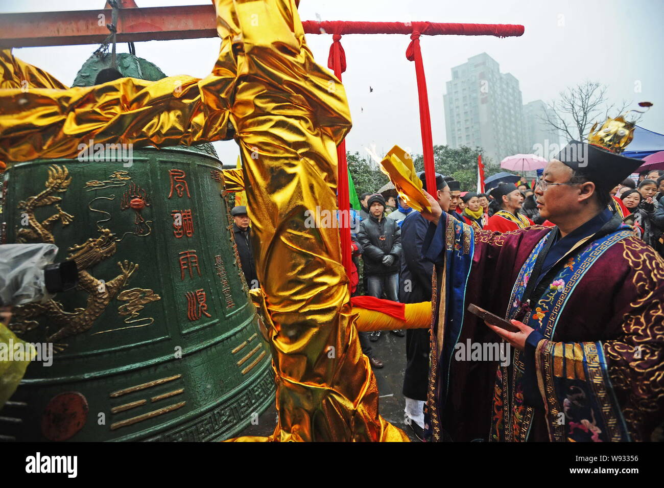 A Chinese Taoist priest (front right) holds a religious rite for bell ...