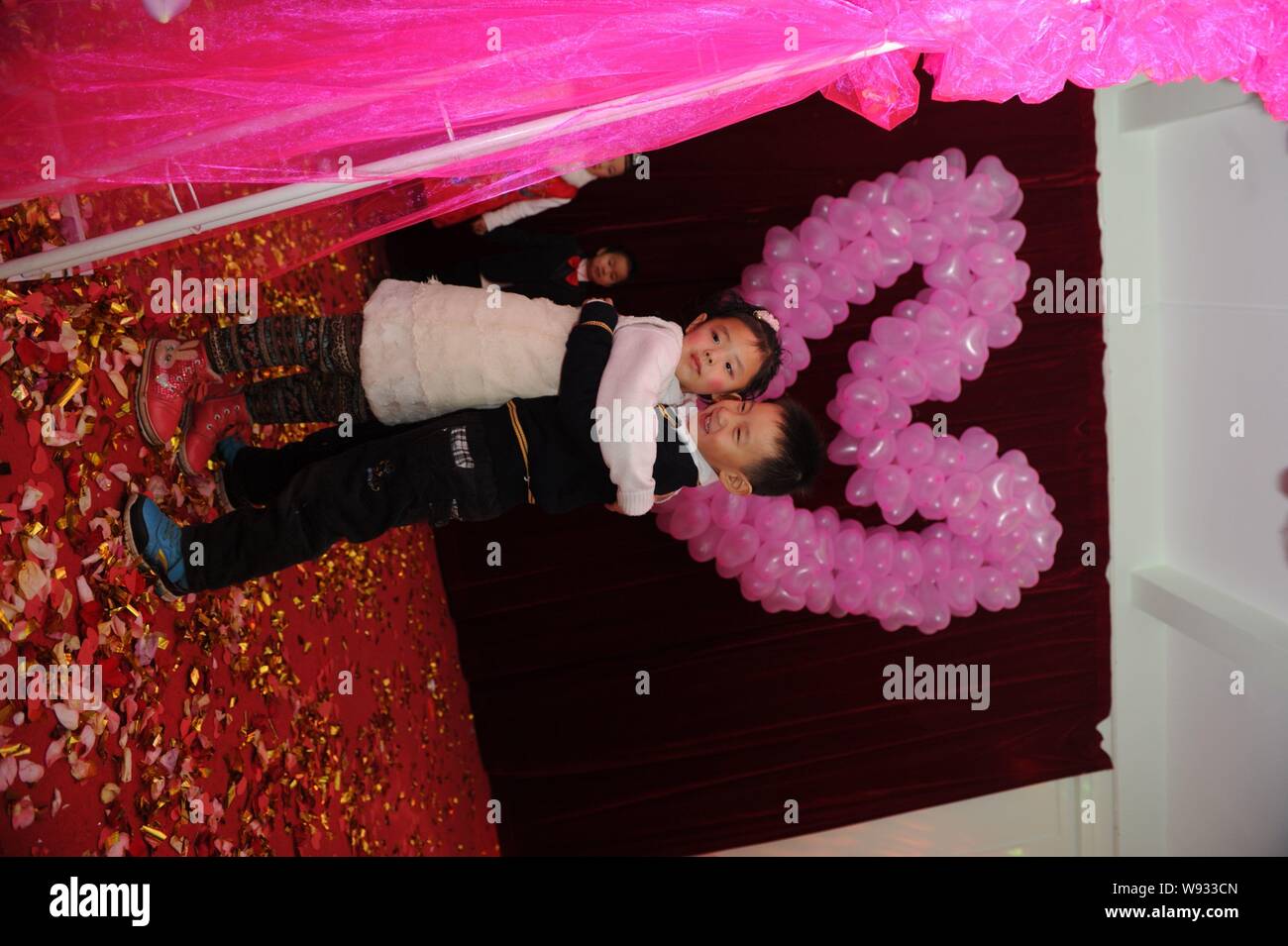 Children hug city hi-res stock photography and images - Alamy