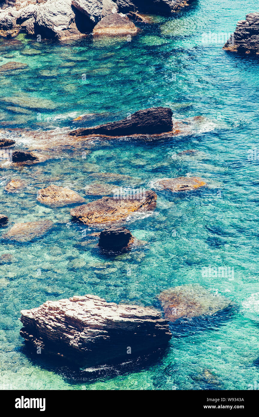 Beautiful blue turquoise sea water with rocks, looking like a lagoon ...