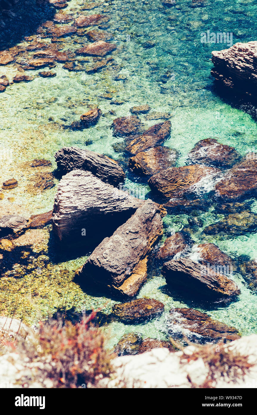 Beautiful blue turquoise sea water with rocks, looking like a lagoon ...