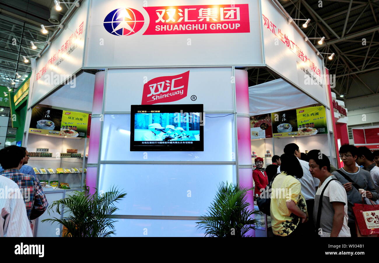 --FILE--Visitors crowd the stand of Shuanghui Group, also known as ...