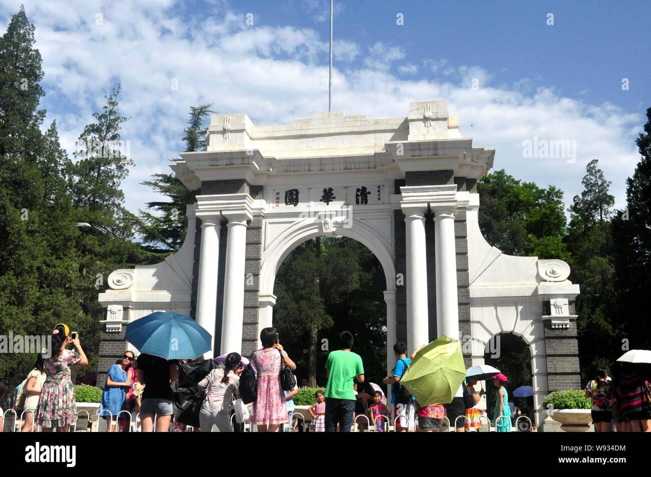 --FILE--People take photos at the symbolic Second Gate of Tsinghua ...