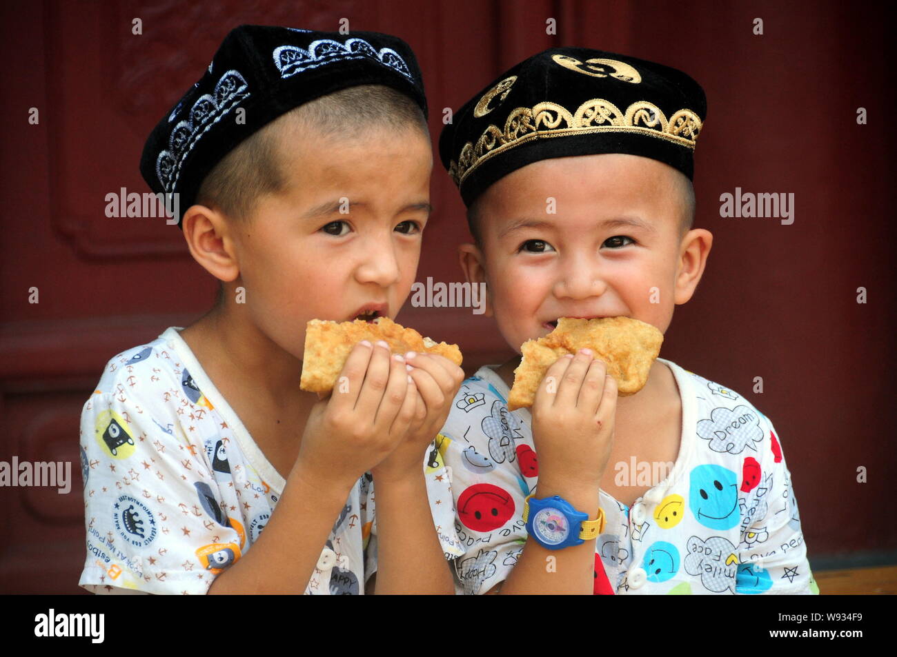 Young Chinese Muslims eat food during an Eid al-Fitr morning prayer ...