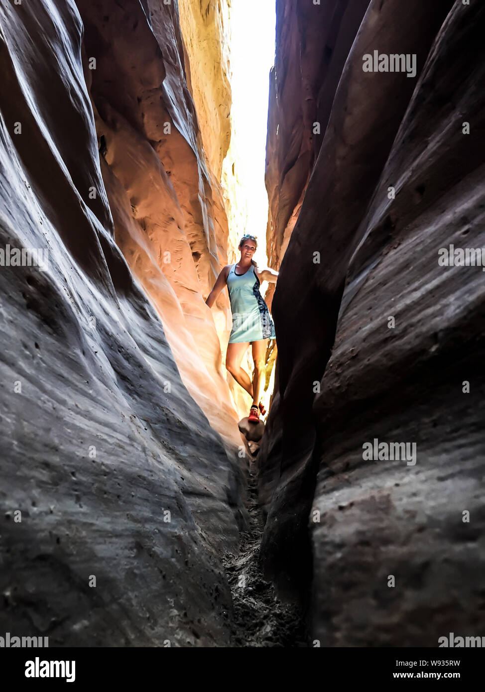 A young woman poses in Little Wild Horse Canyon Stock Photo - Alamy