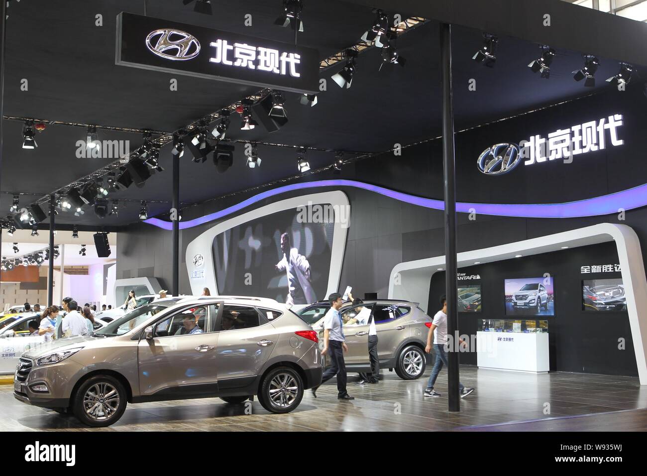 --FILE--People visit the stand of Beijing Hyundai, a joint venture of ...