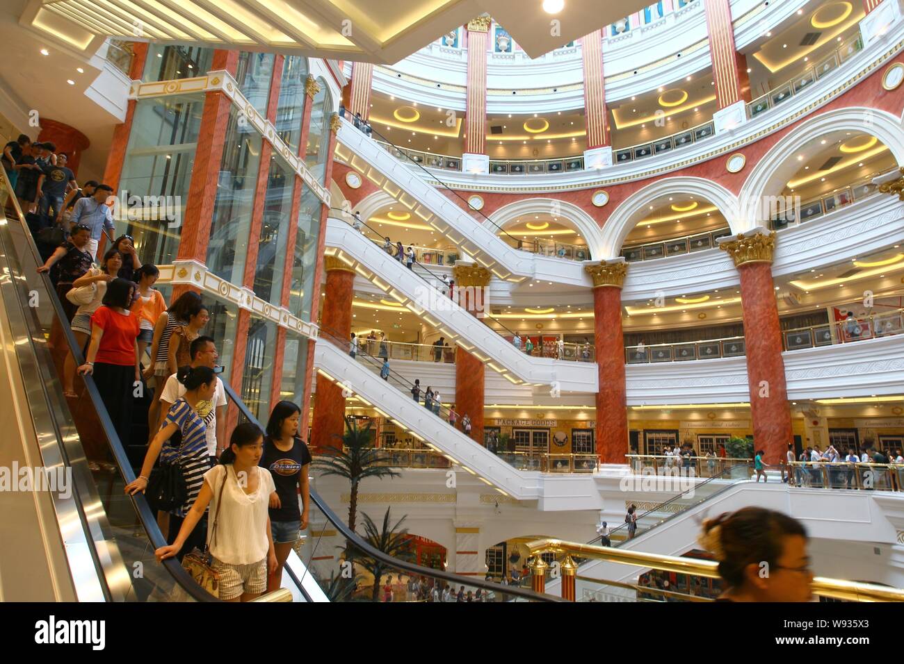 Customers visit the Global Harbor shopping center in Shanghai, China, 5 ...