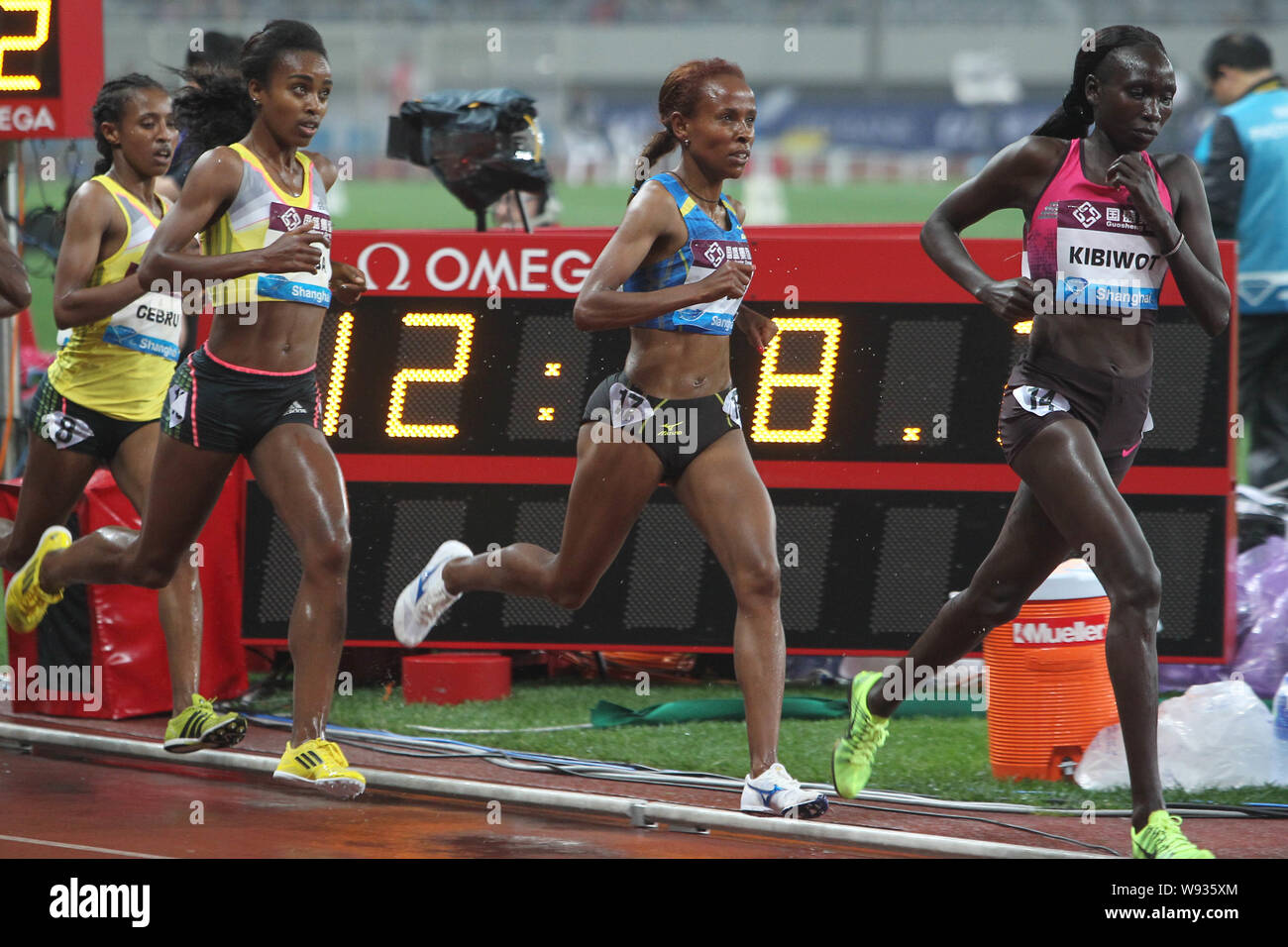 Meseret Defar, second right, and Tirunesh Dibaba, second left, of ...