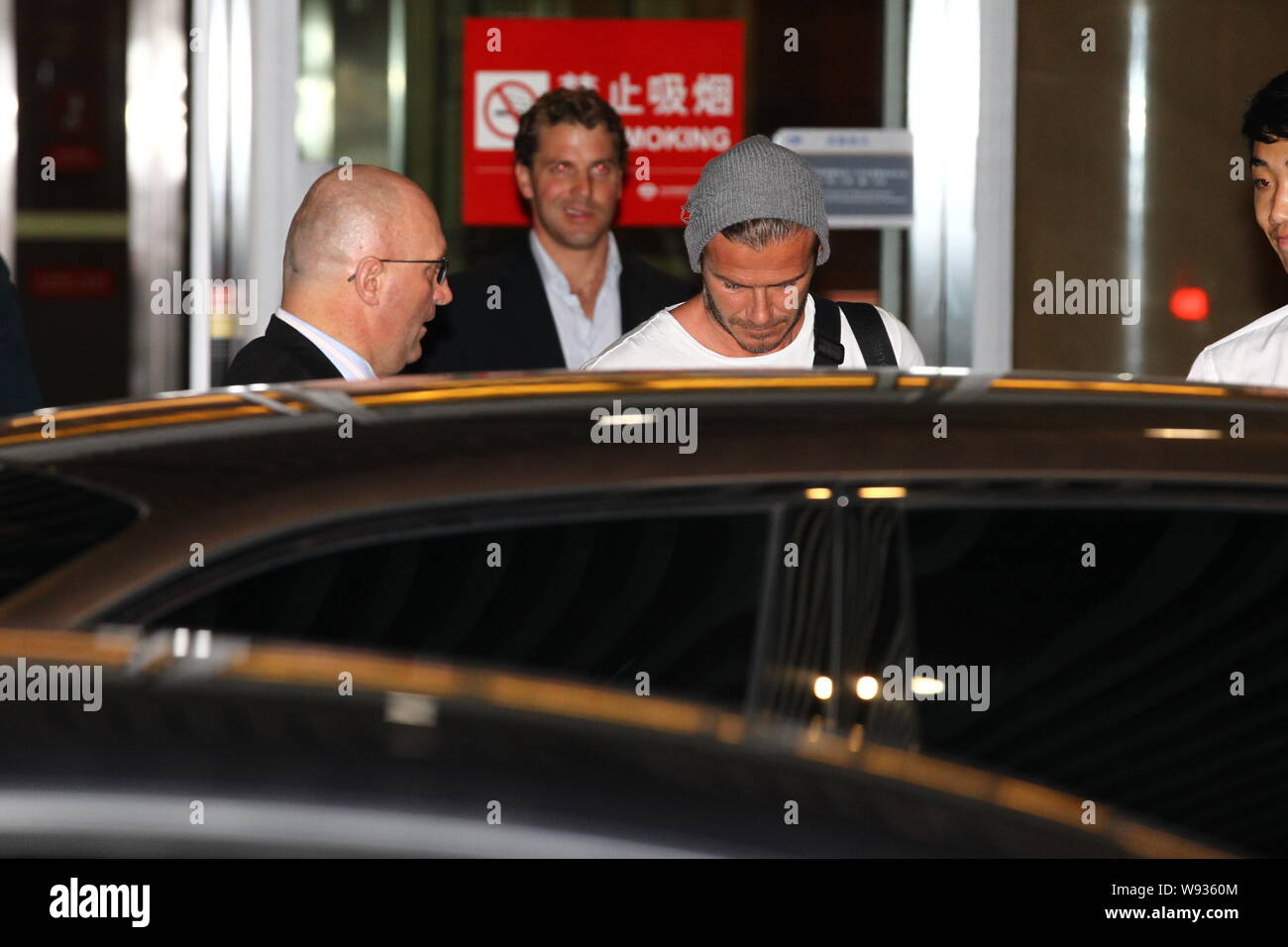 English football superstar David Beckham, center, walks towards a ...
