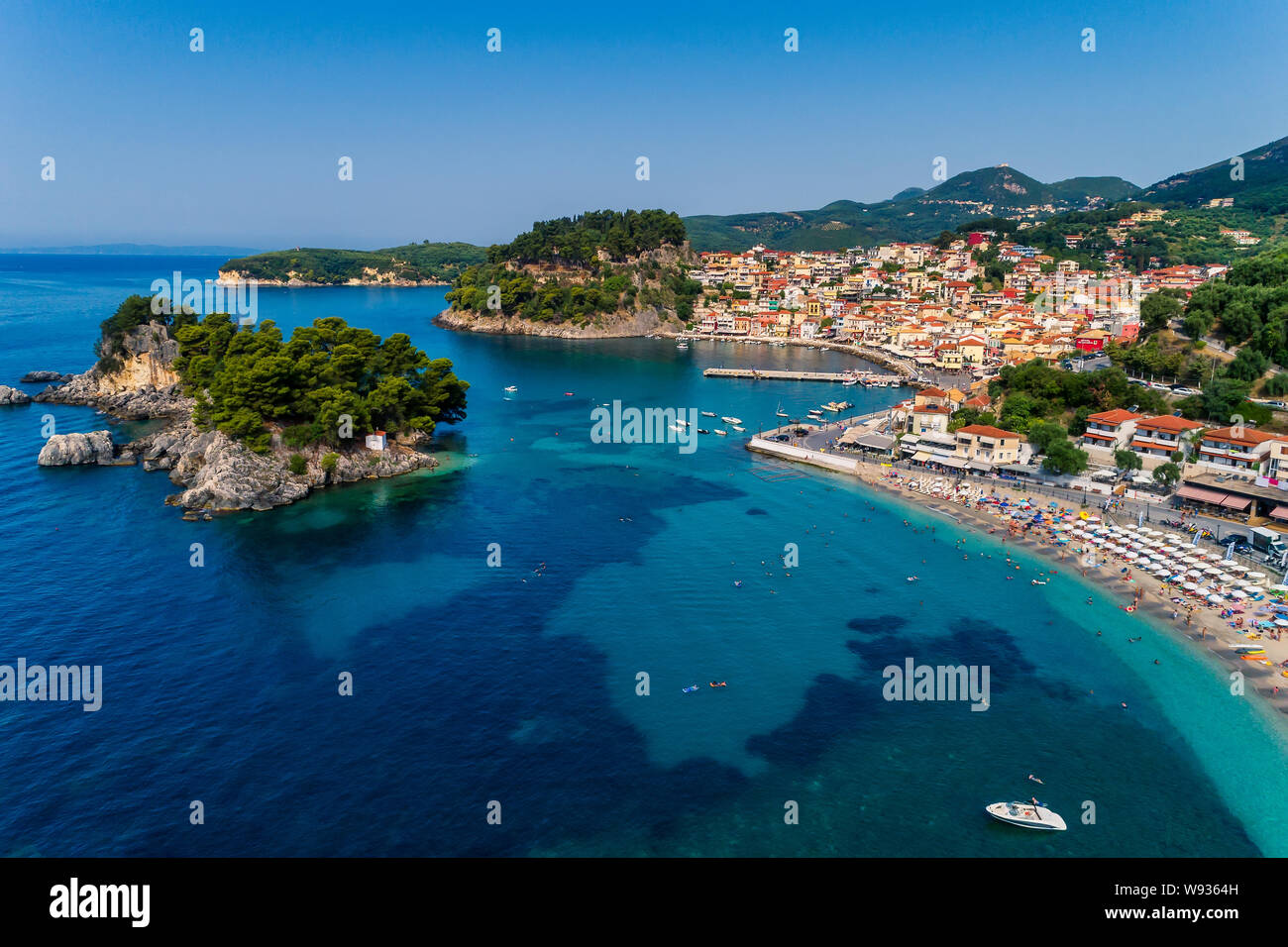 Aerial cityscape view of the coastal city of Parga, Greece during the ...