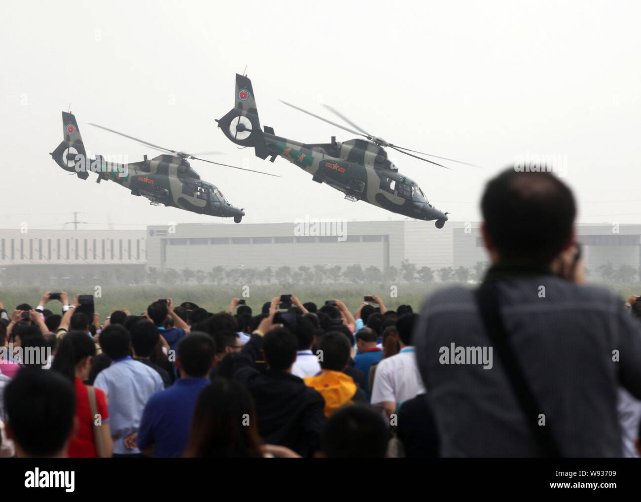 Chinese WZ-9 military helicopters perform a flight demonstration at the ...