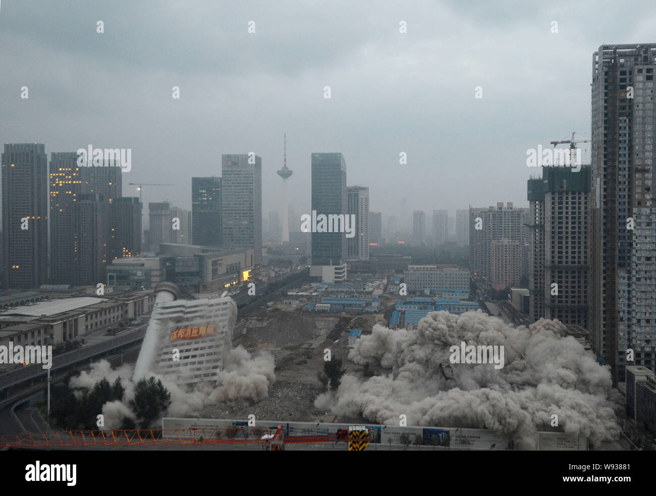 Heavy smoke rises after the thermometer-alike building exploded during ...