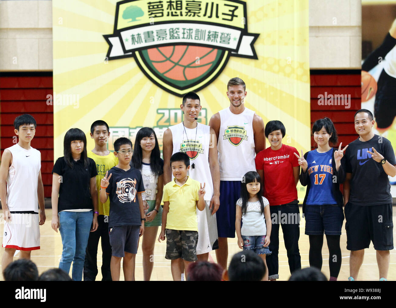 NBA star Jeremy Lin of the Houston Rockets basketball team, center, his ...