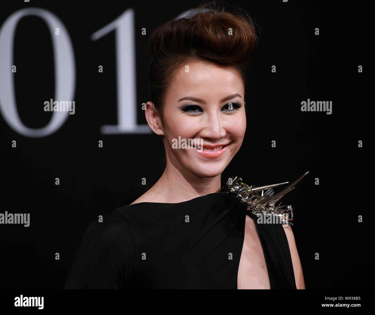 U.S. singer Coco Lee poses on the red carpet as she arrives at the ...