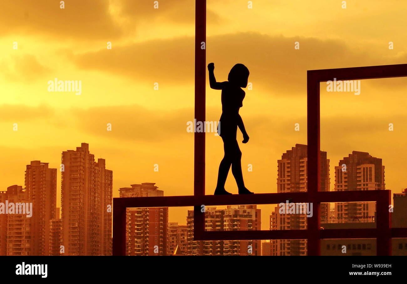 --FILE--A sculpture showing a woman keeping balance on a beam is seen ...