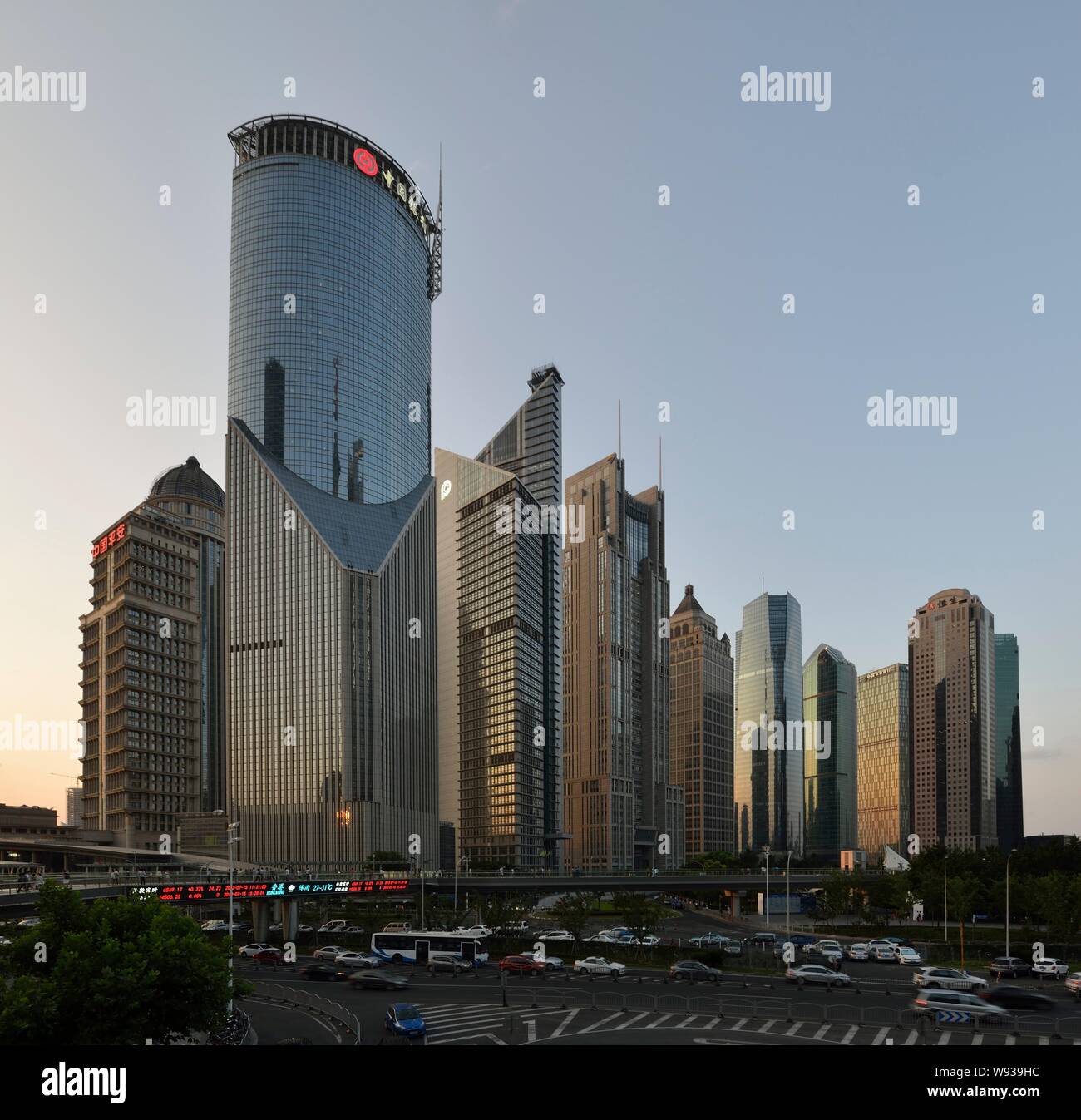 View of a busy street, Bank of China (BOC) building and other high-rise ...