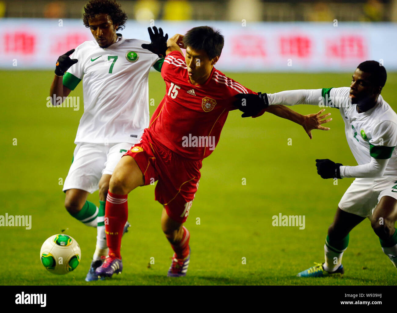Jiang Ning of China, center, challenges Yasser Al-Shahrani, left, and ...