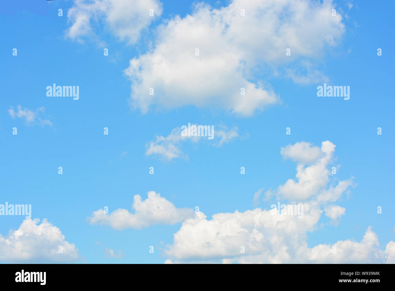 Colorful heavenly angelic white clouds and blue, blue sky with sunlight ...