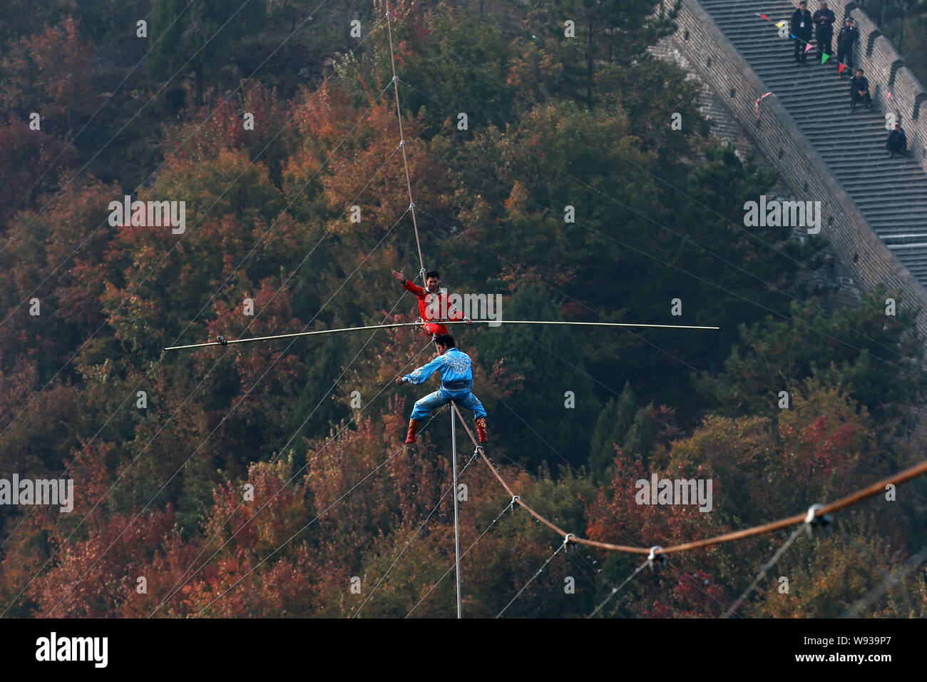 Chinas tightrope walking prince Adili Wuxor, back, and his student ...