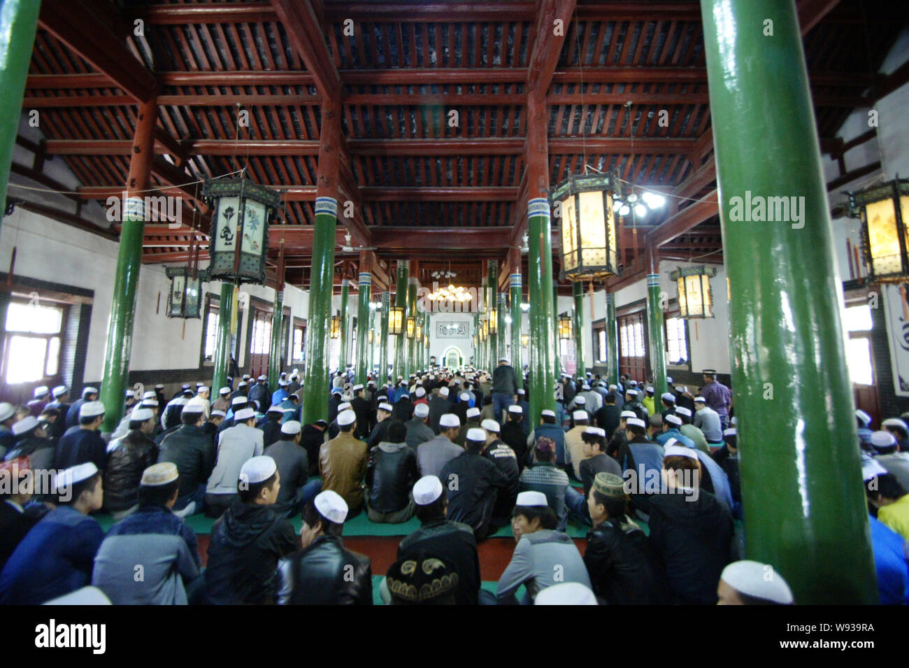 Chinese Muslims attend an Eid al-Adha prayer session at a mosque in ...