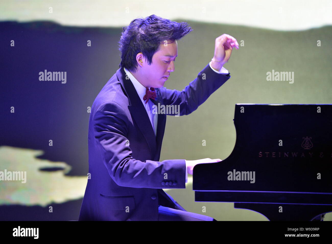 Chinese pianist Li Yundi performs during the Phoenix Fashion Choice ...