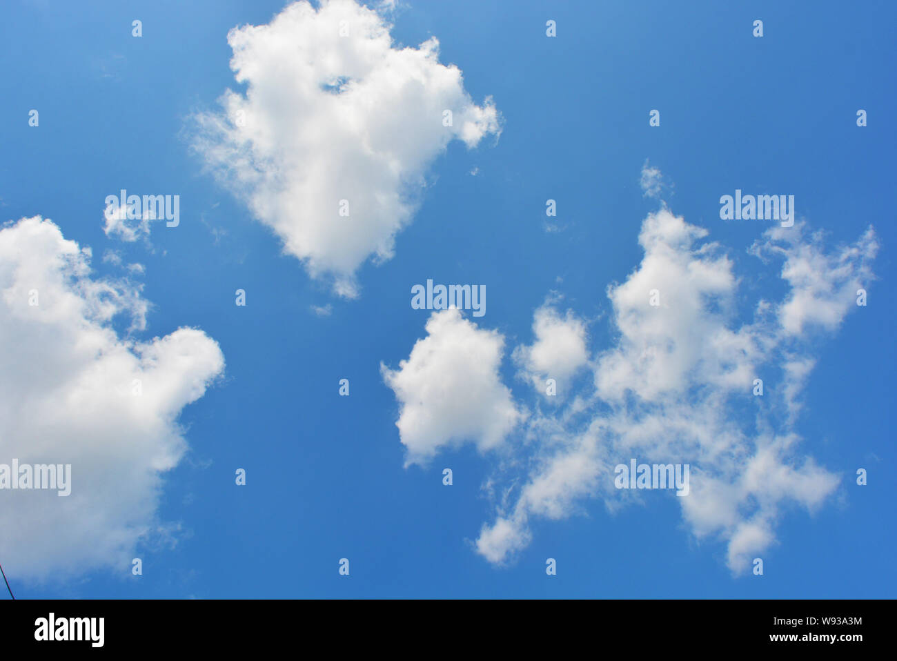 Colorful heavenly angelic white clouds and blue, blue sky with sunlight ...
