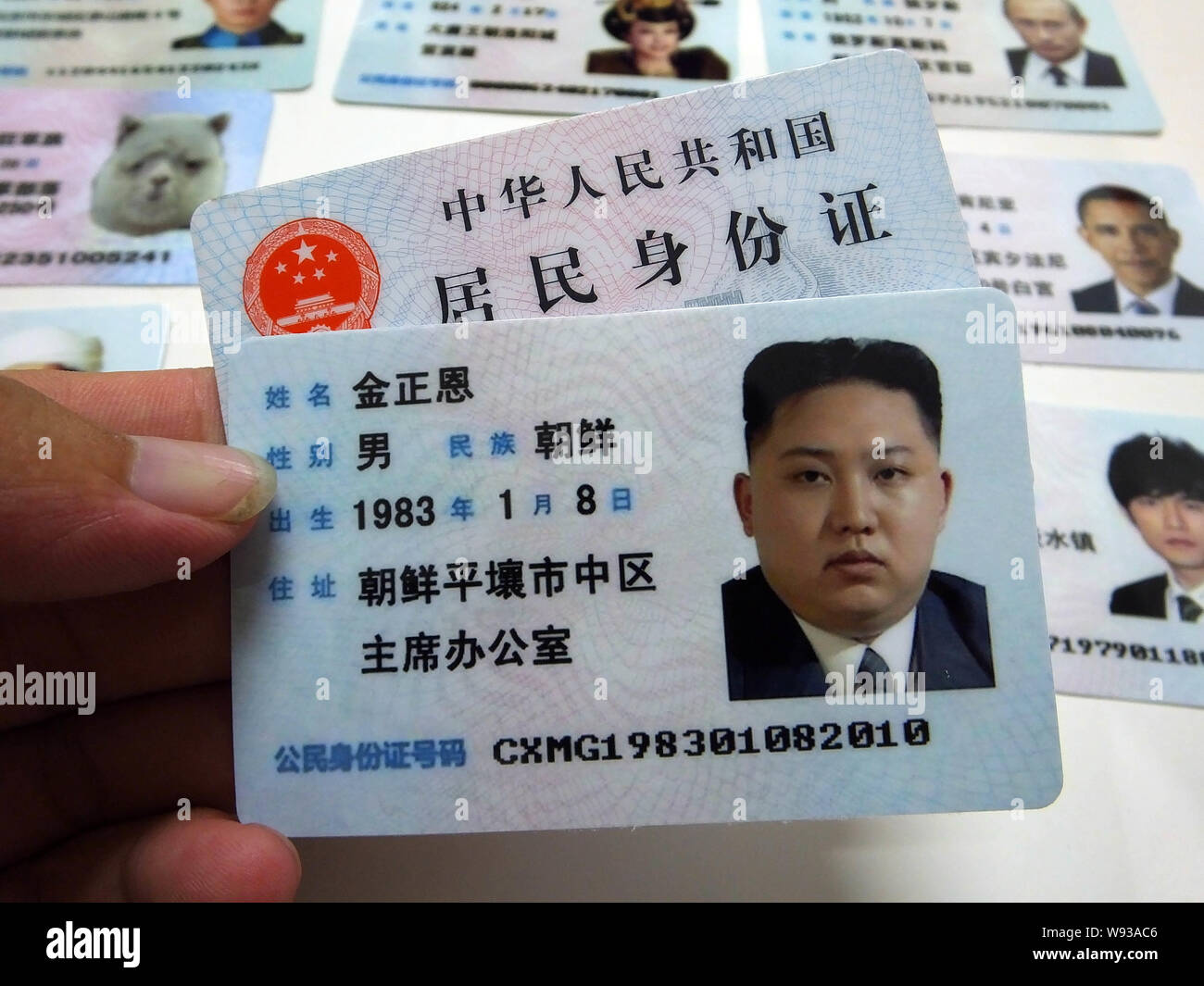 A Man Shows A Fake Chinese ID Card Of North Korean Leader Kim Jong Un
