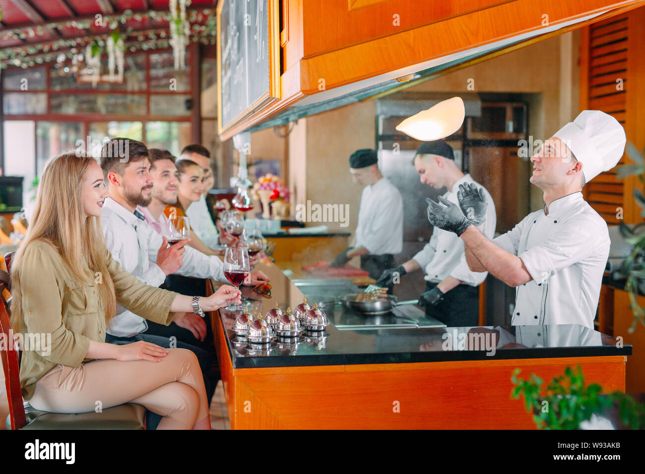 The chef prepares food in front of the visitors in the restaurant Stock ...