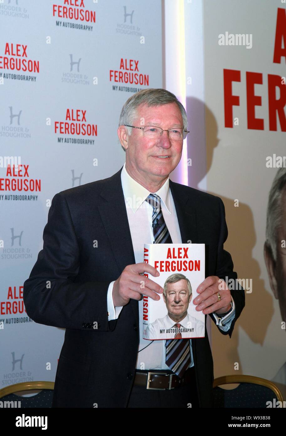 Sir Alex Ferguson poses with a copy of his book, Alex Ferguson My ...