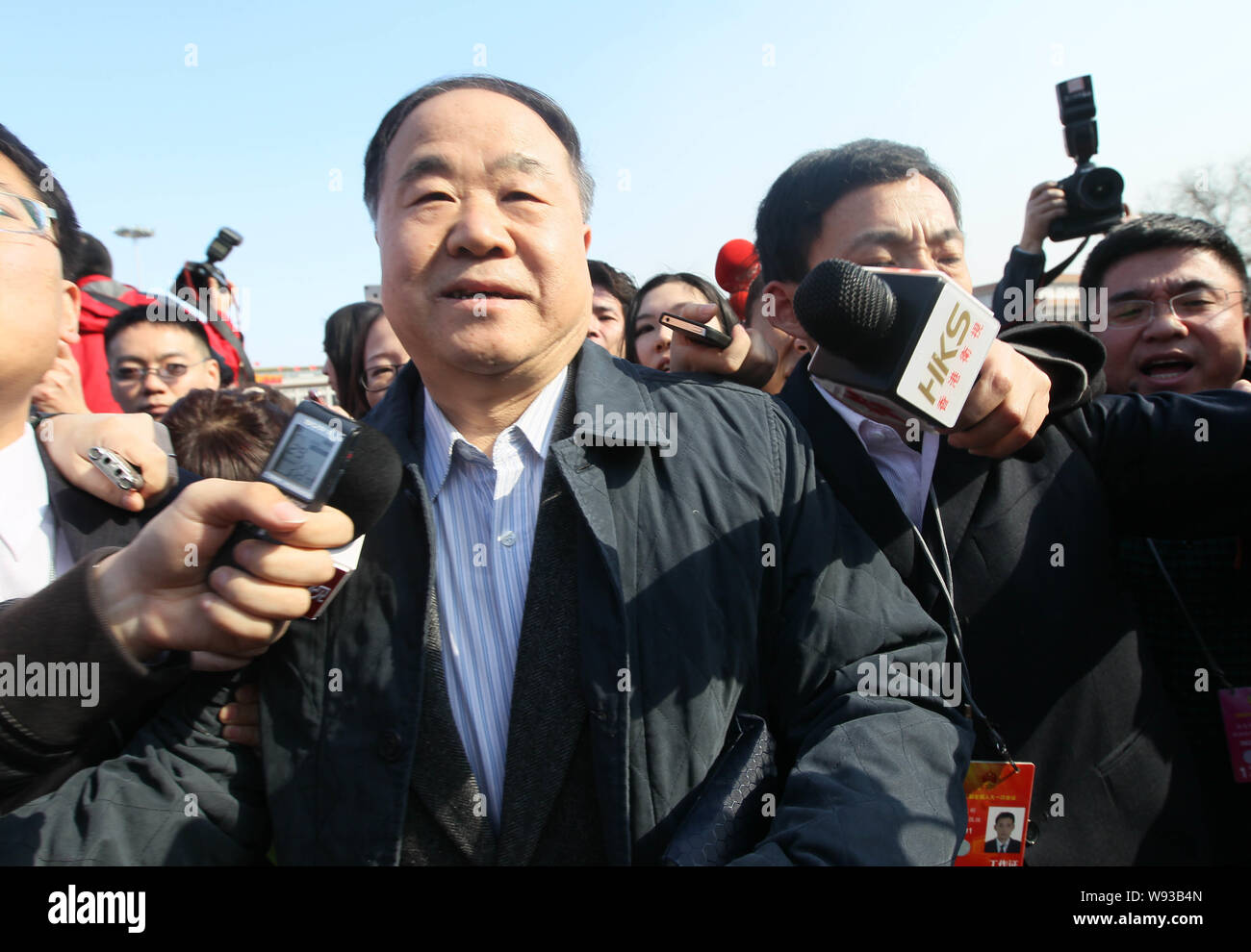 Chinese writer Guan Moye, center, better known by his pen name Mo Yan ...