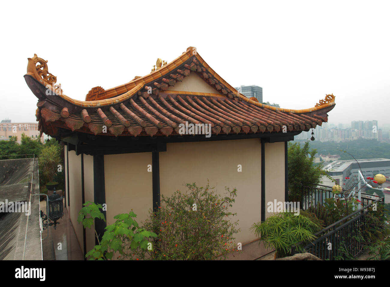 A temple is seen on the rooftop of a high-rise residential apartment ...
