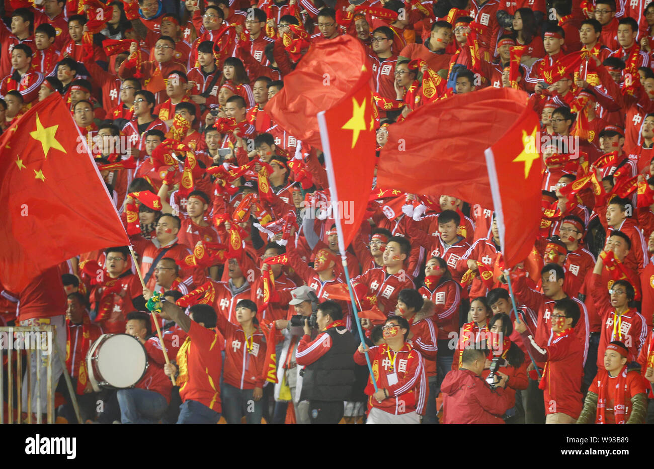 Chinese football fans cheer during a Group C match of the AFC Asian Cup ...