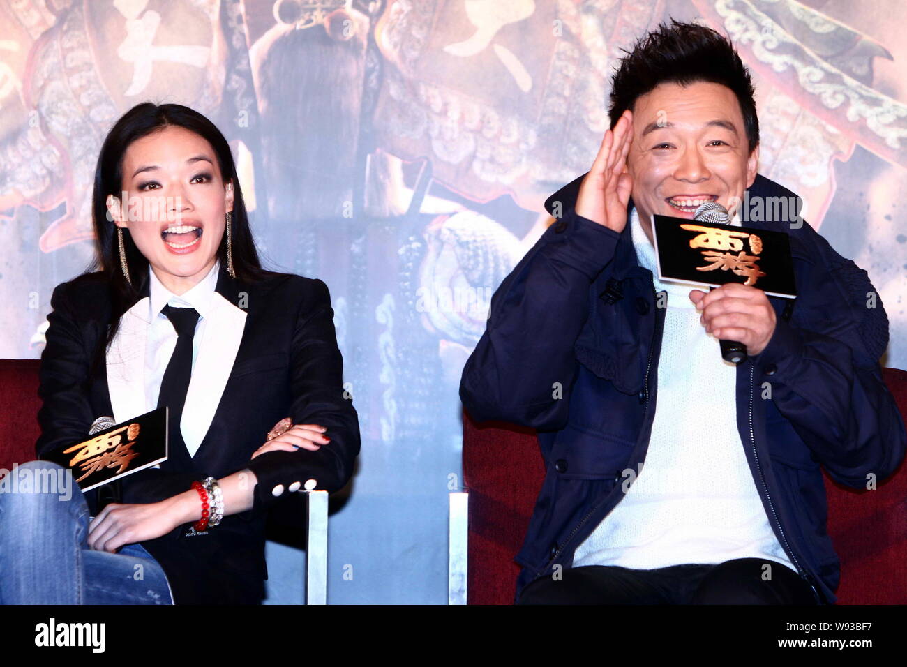 Chinese actor Huang Bo, right, speaks next to Taiwanese actress Shu Qi ...