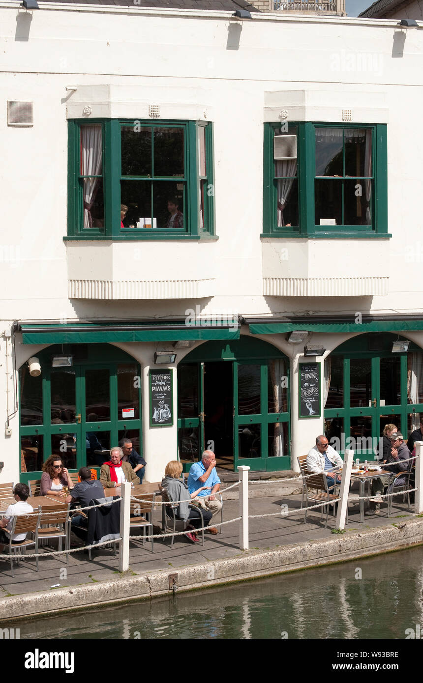 People enjoying a drink outside The Anchor pub, at the side of the ...