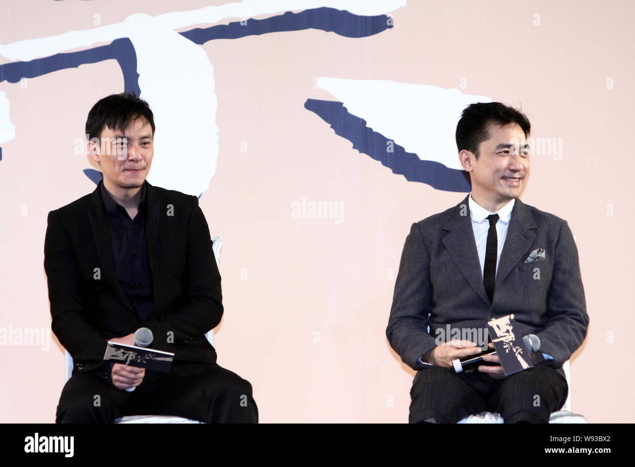 Taiwanese actor Zhang Zhen (left) and Hong Kong actor Tony Leung attend ...