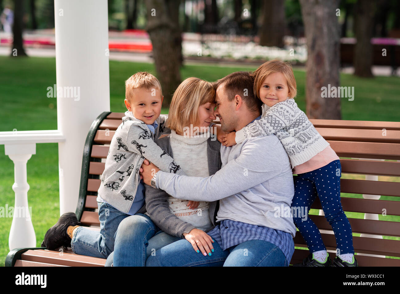 Happy family with two kids having fun together in the park outdoor ...