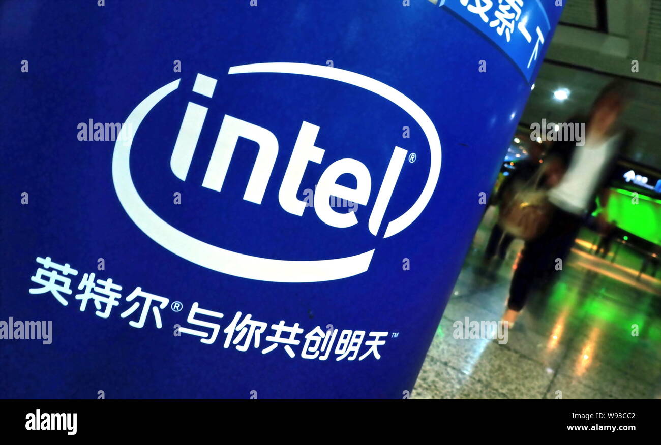 --FILE--Pedestrians walk past an advertisement of Intel in Shanghai ...