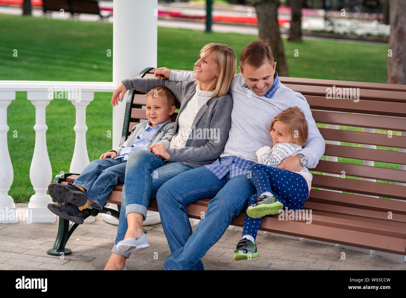 Happy family with two kids having fun together in the park outdoor ...