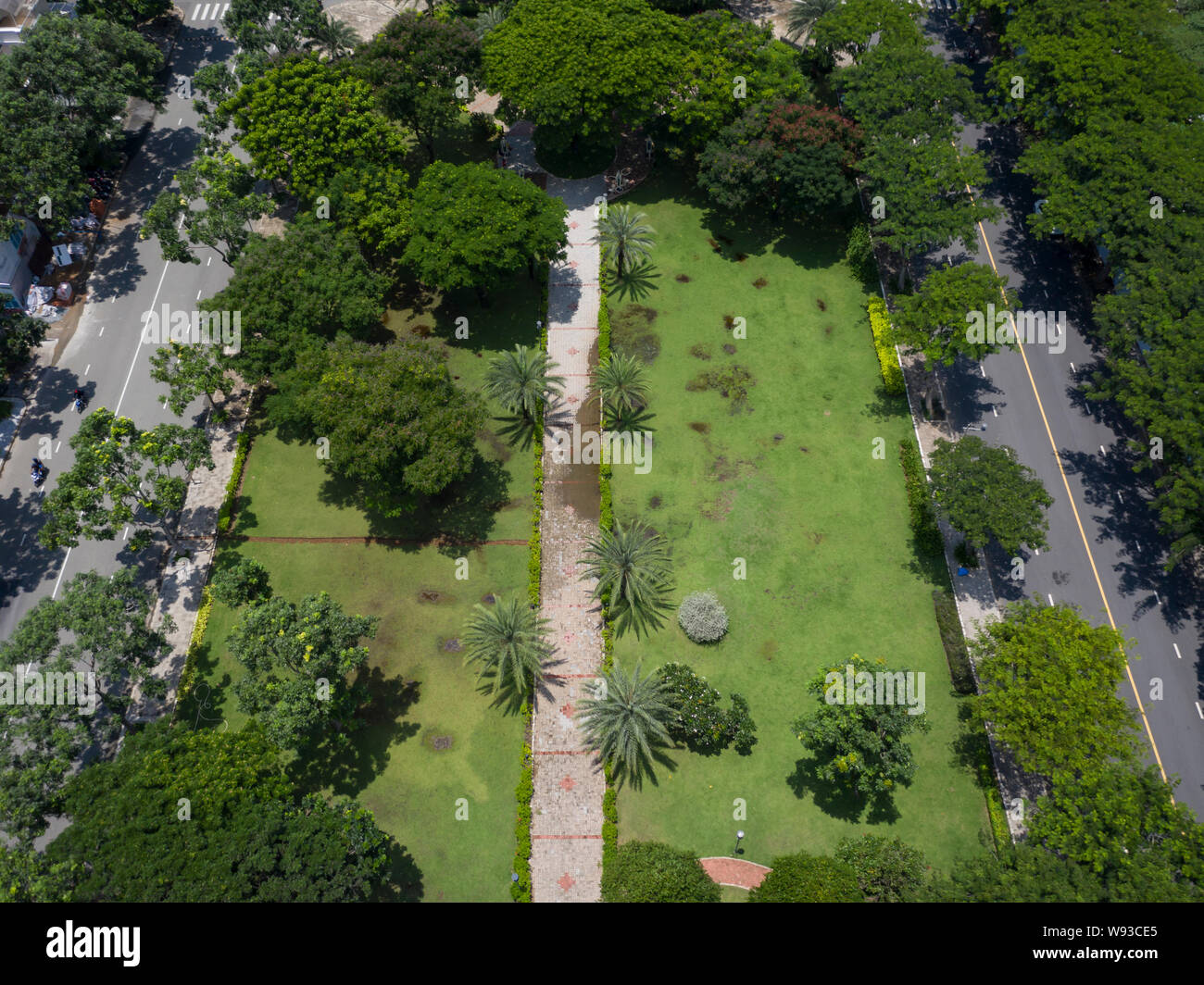 aerial view of modern urban park featuring lakes, lush gardens, bridges ...