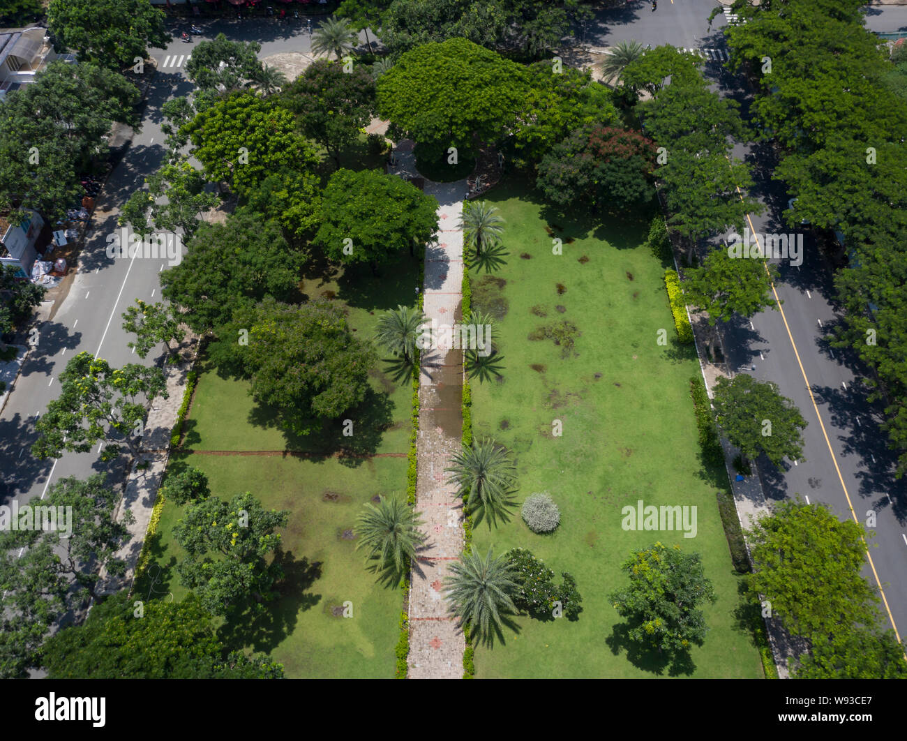 aerial view of modern urban park featuring lakes, lush gardens, bridges ...