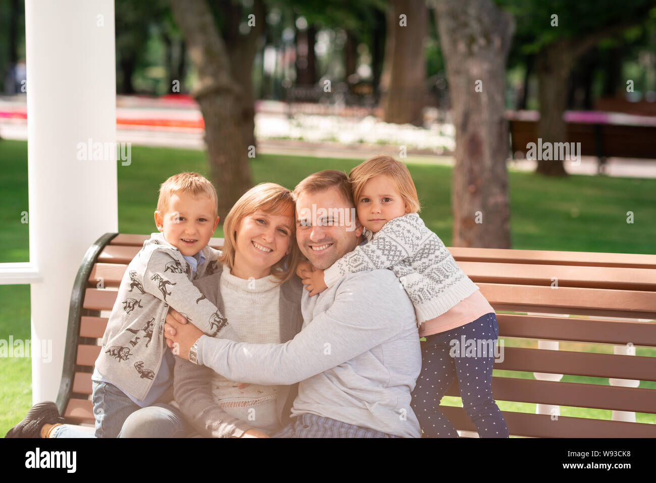 Happy family with two kids having fun together in the park outdoor ...