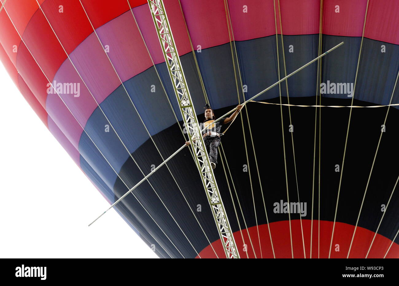 Chinese Uighur tightrope walker Aisikaier Wubulikaisimu walks on a ...