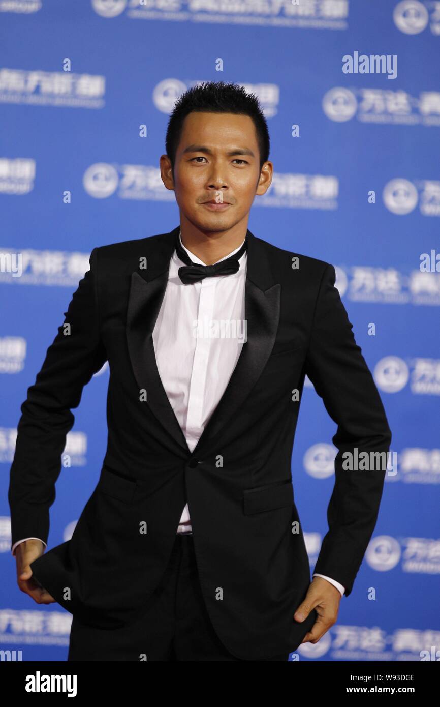 Hong Kong actor Wallace Chung poses as he arrives at a launching party ...