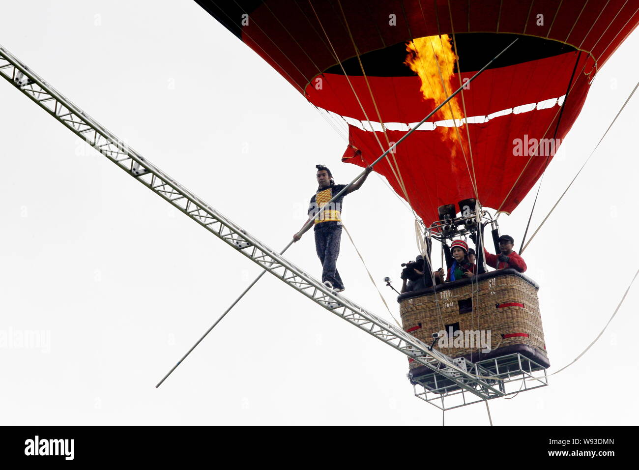 Chinese Uighur tightrope walker Aisikaier Wubulikaisimu walks on a ...