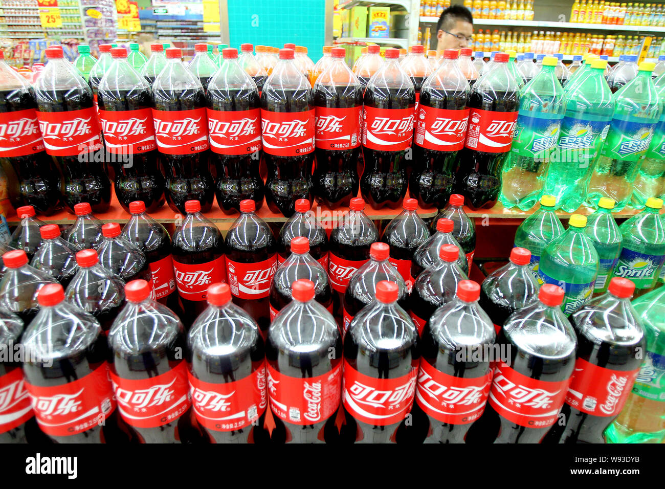 --FILE--Bottles of cola and Sprite soda of Coca-Cola are for sale at a ...