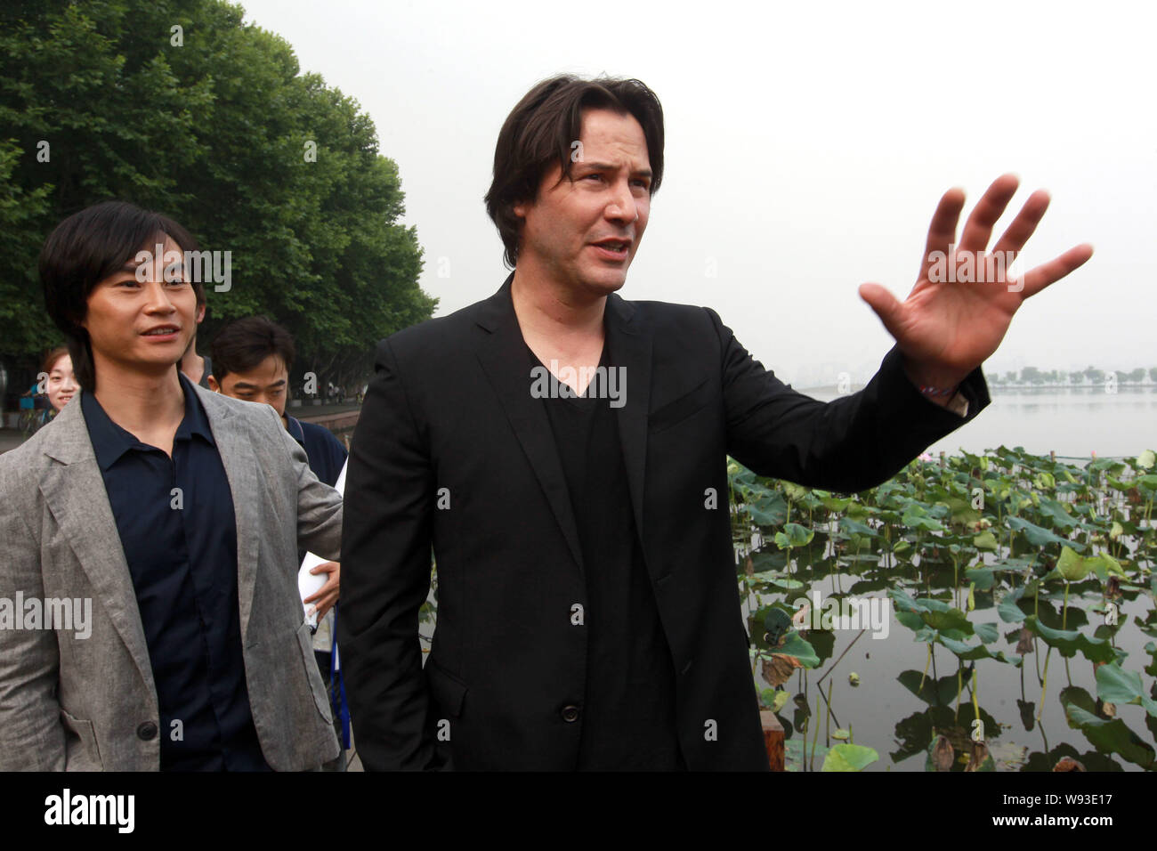 Canadian actor and director Keanu Reeves, right, speaks next to Chinese ...
